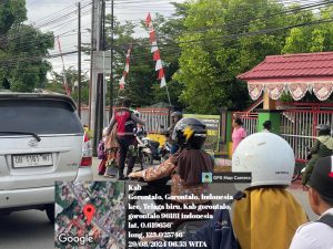 Kesigapan Dit Samapta Polda Gorontalo, Bantu Warga dan Pelajar Menyeberang Jalan – Polda Gorontalo